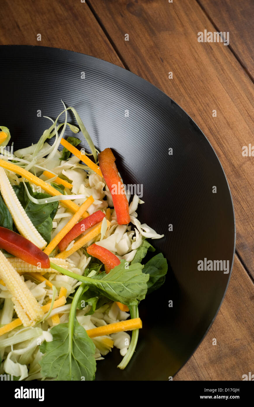 Raw stir fry food in wok ready for cooking Stock Photo - Alamy