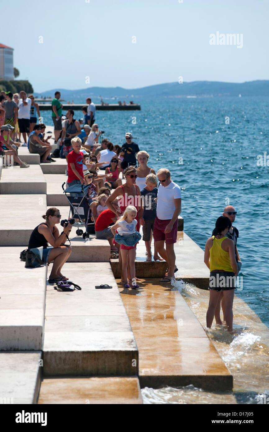 People on the steps of the 'Sea Organ' in Zadar on the Adriatic coast ...