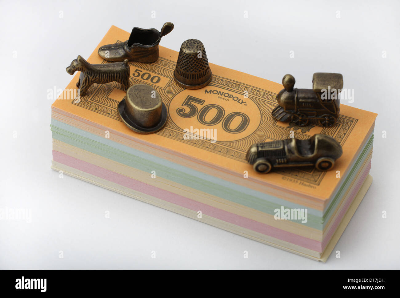 Monopoly money and metal playing traditional pieces Stock Photo - Alamy