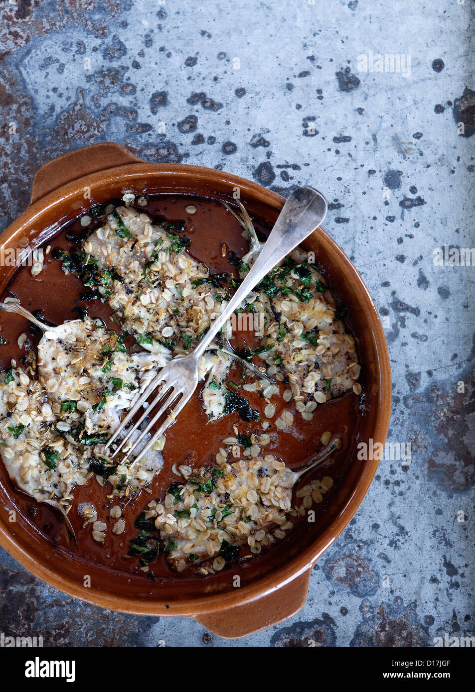 Plate of fish with oatmeal and herbs Stock Photo - Alamy