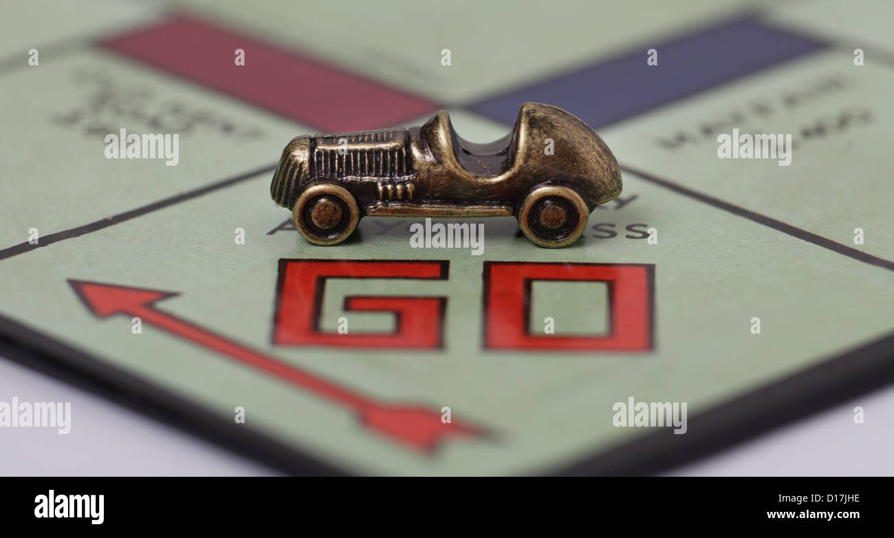 A car players piece on the Go square of a Monopoly board Stock Photo ...
