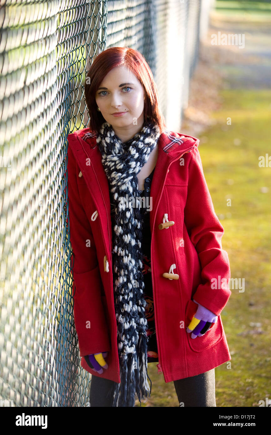 Woman lean against fence hi-res stock photography and images - Alamy