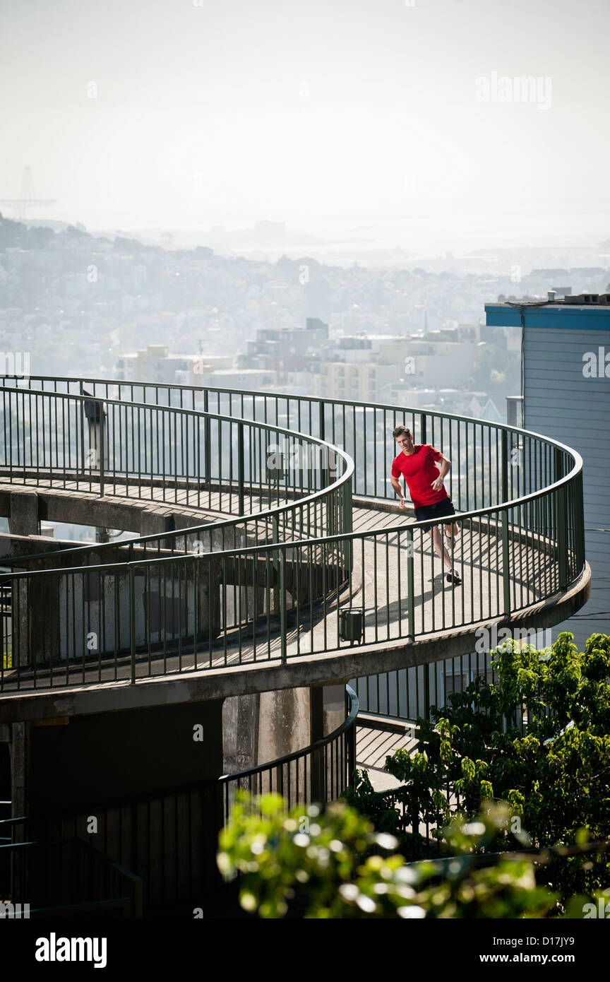 Man running on city ramp Stock Photo - Alamy
