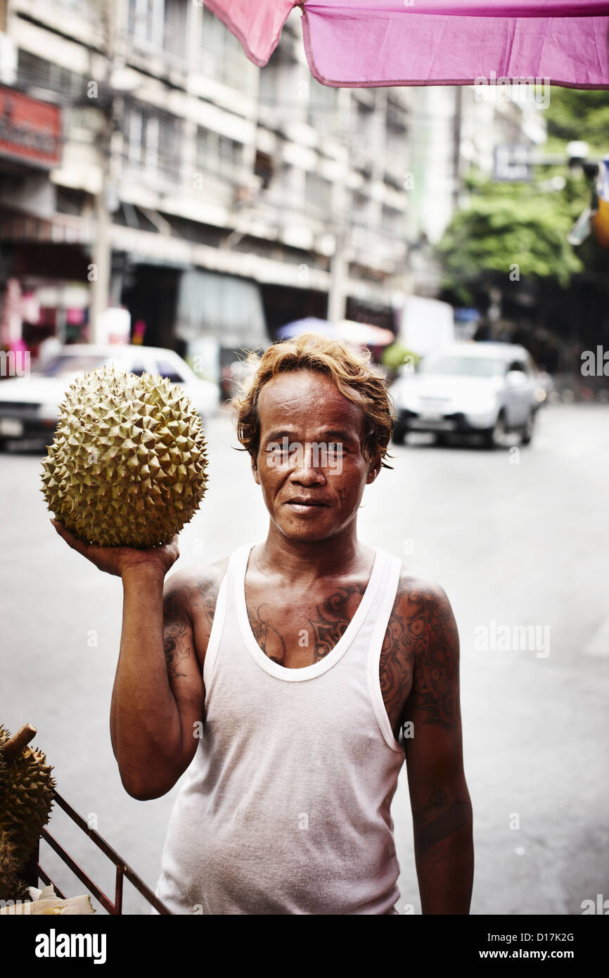 Man selling durian fruit on street Stock Photo - Alamy