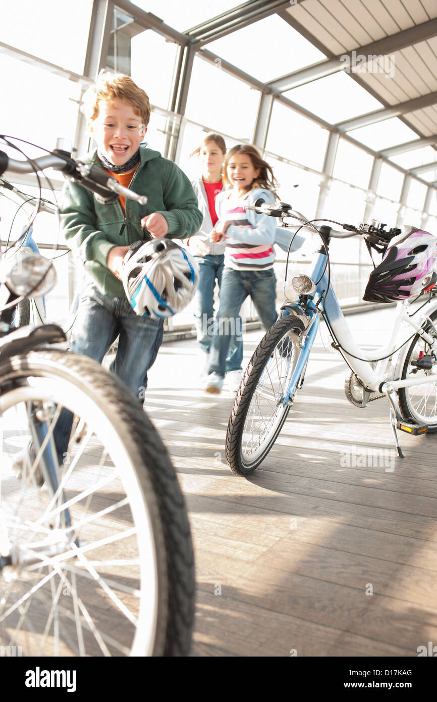 Children racing to bicycles in tunnel Stock Photo - Alamy