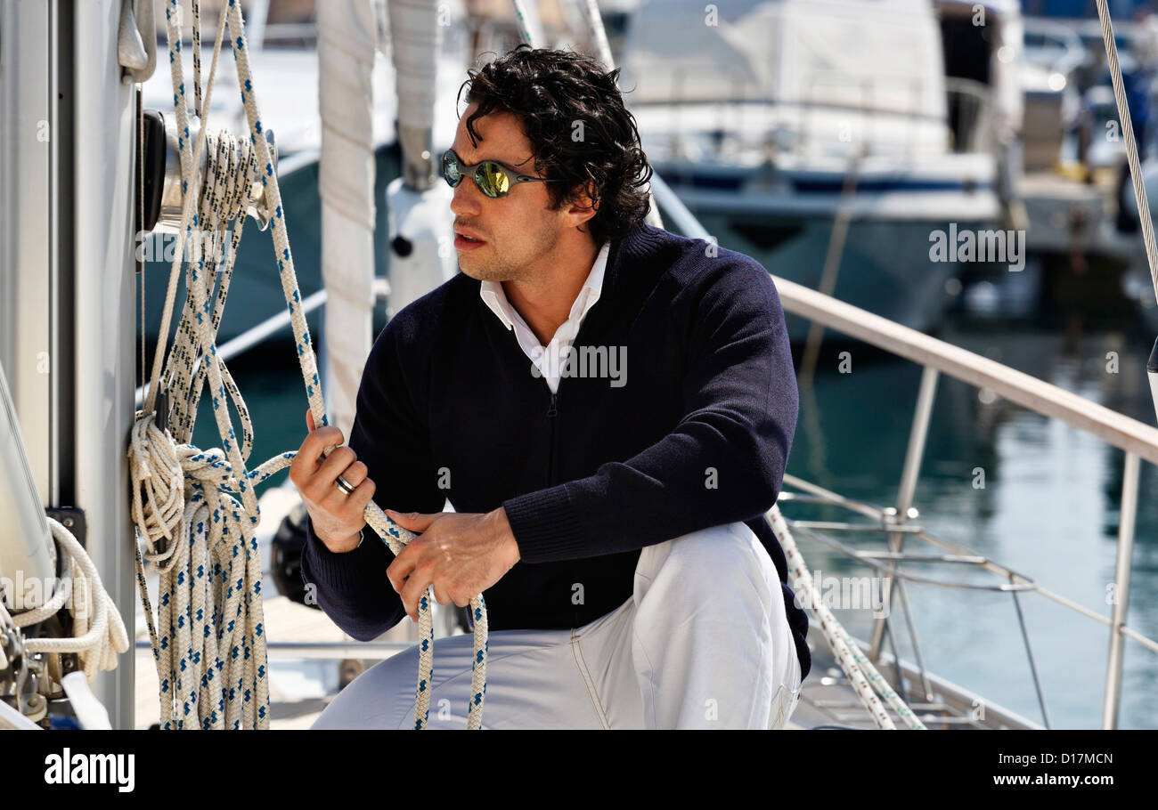 Italy, Tuscany, young sailor dressed casual on a sailing boat Stock ...