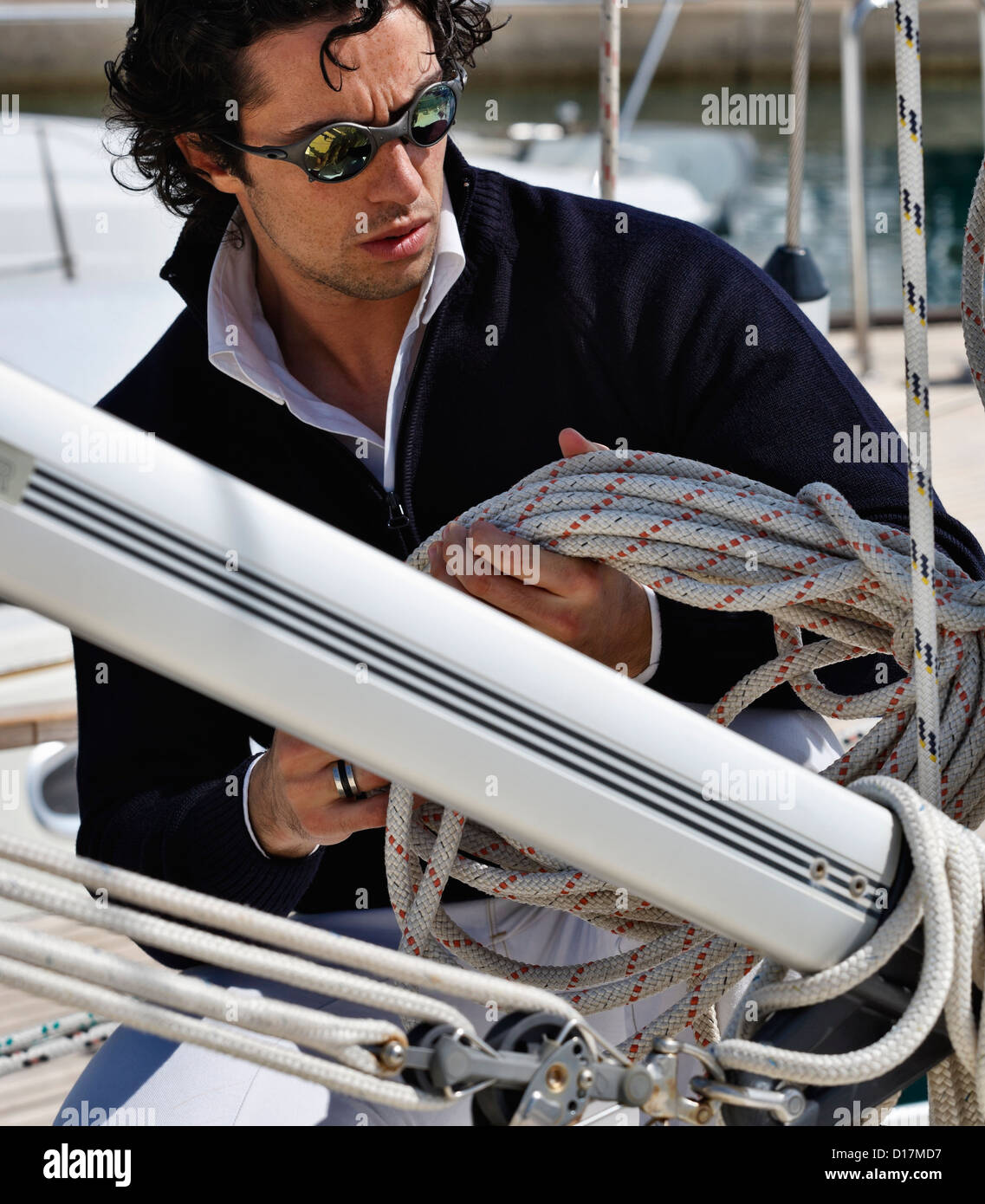 Italy, Tuscany, young sailor dressed casual on a sailing boat Stock ...