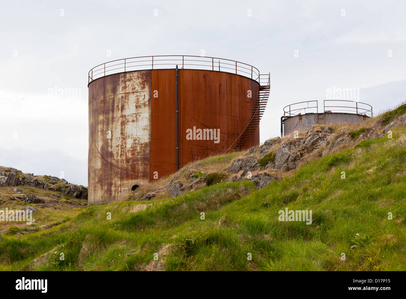 Rusted above ground storage tanks at dull day Stock Photo - Alamy
