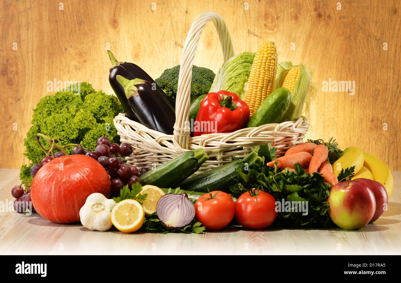 Fruits and vegetables in wicker basket Stock Photo - Alamy
