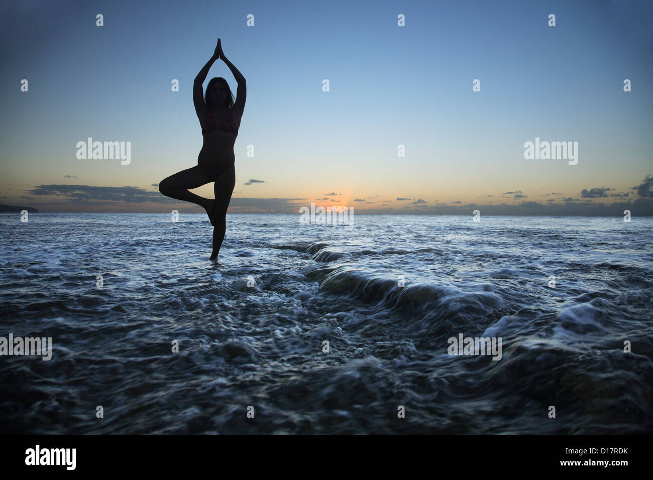Hawaii, Oahu, Fit Young Girl On The Beach Doing Yoga On The Rocky ...