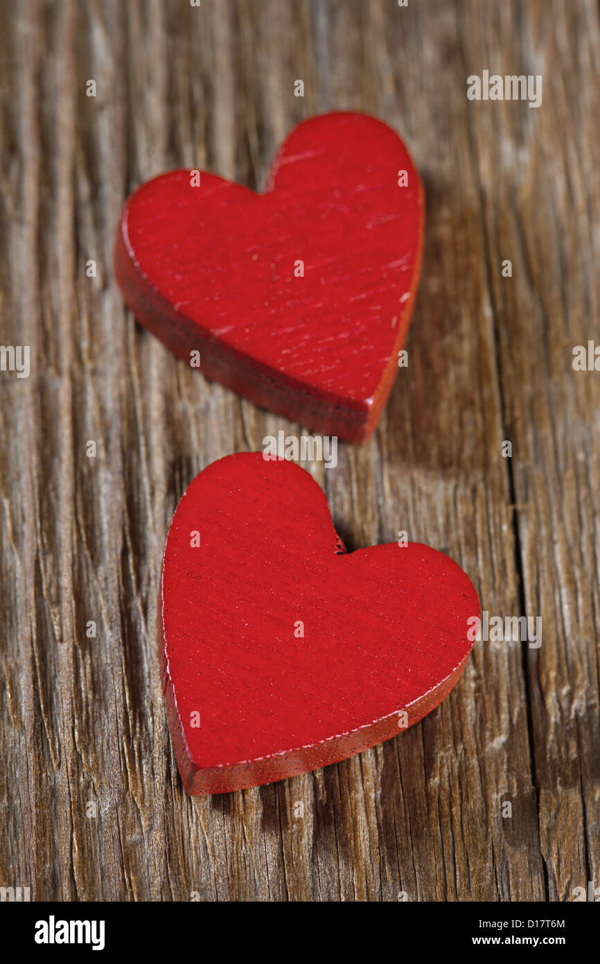 Two red hearts on wooden rustic background Stock Photo - Alamy