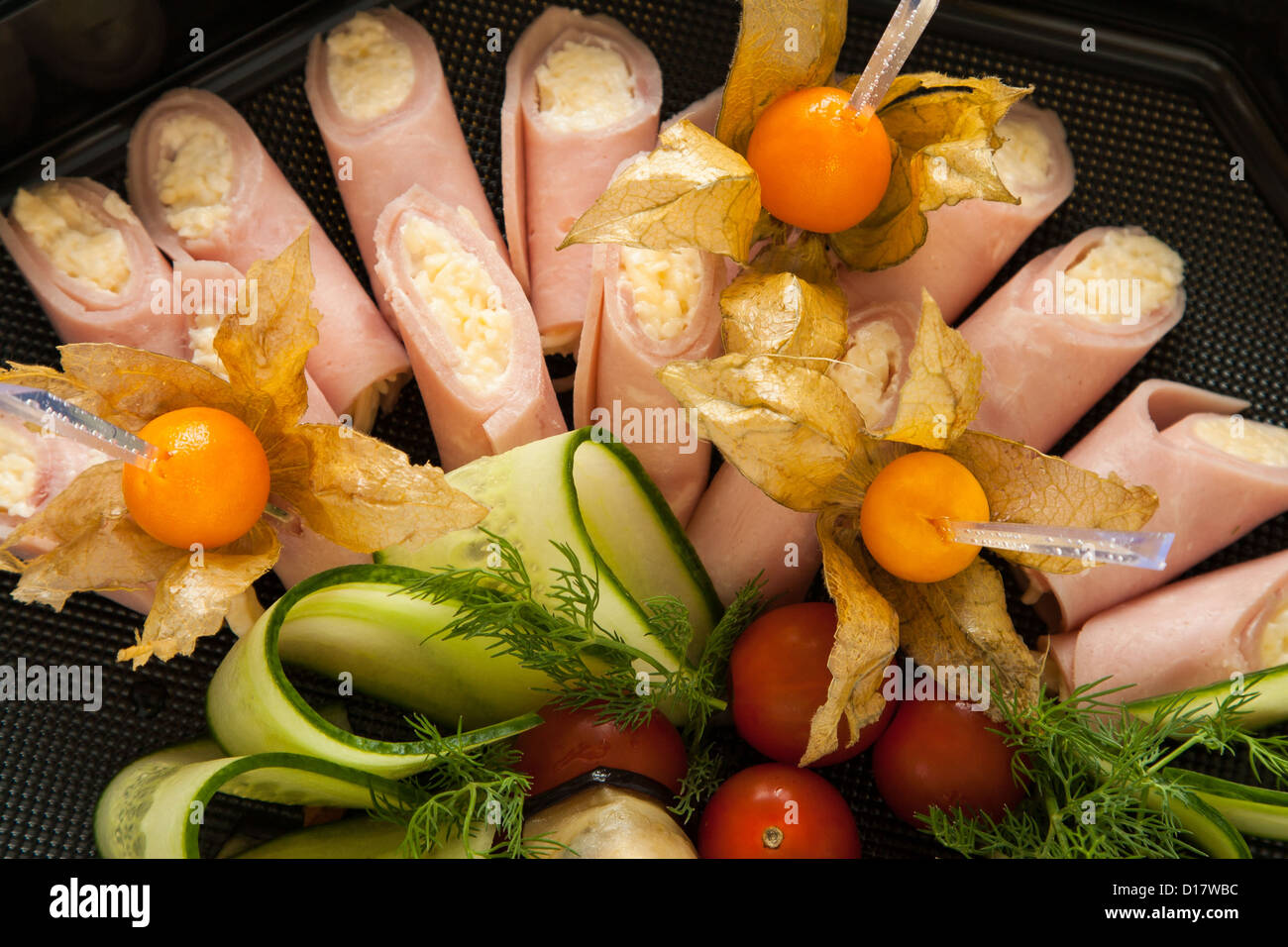 rolled ham with cheese for holiday party Stock Photo - Alamy