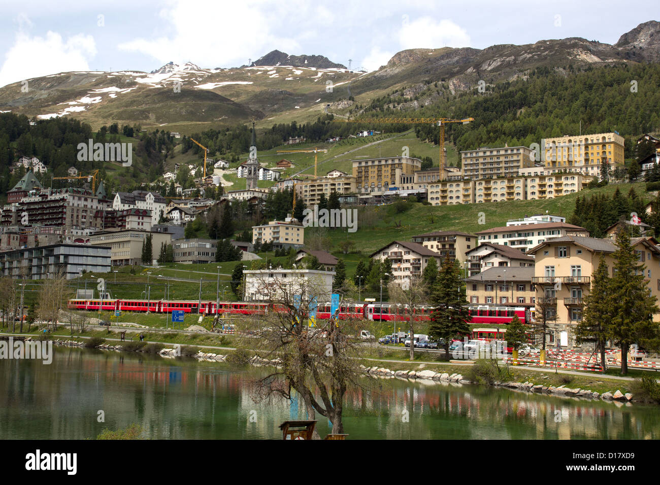 St. Moritz, Switzerland with red mountain train Bernina Express in ...