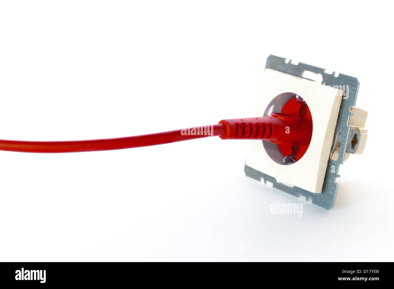 Red power cable plugged into wall outlet against white background Stock ...