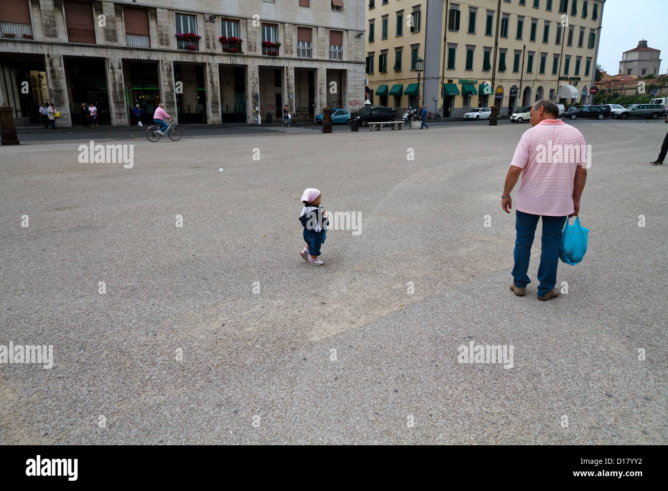 Man with little Child in Livorno in Tuscany, Italy Stock Photo - Alamy