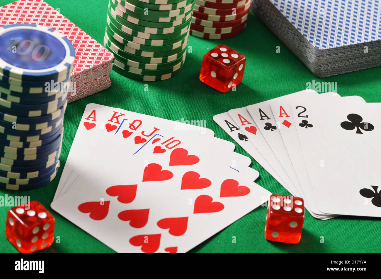 Composition with playing cards on green table Stock Photo - Alamy