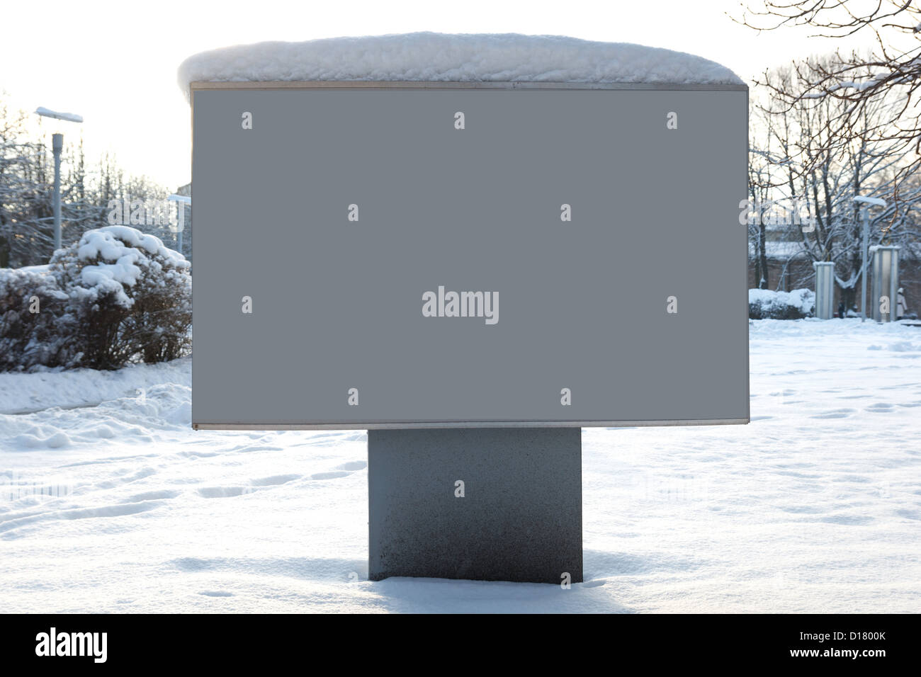 Billboard covered with snow on the background of the park Stock Photo ...