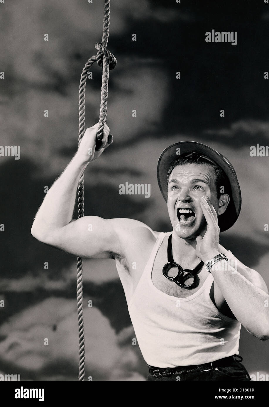 Man holding onto rope and shouting Stock Photo - Alamy