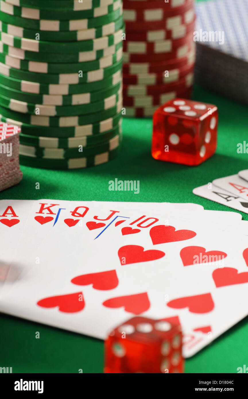 Composition with playing cards on green table Stock Photo - Alamy