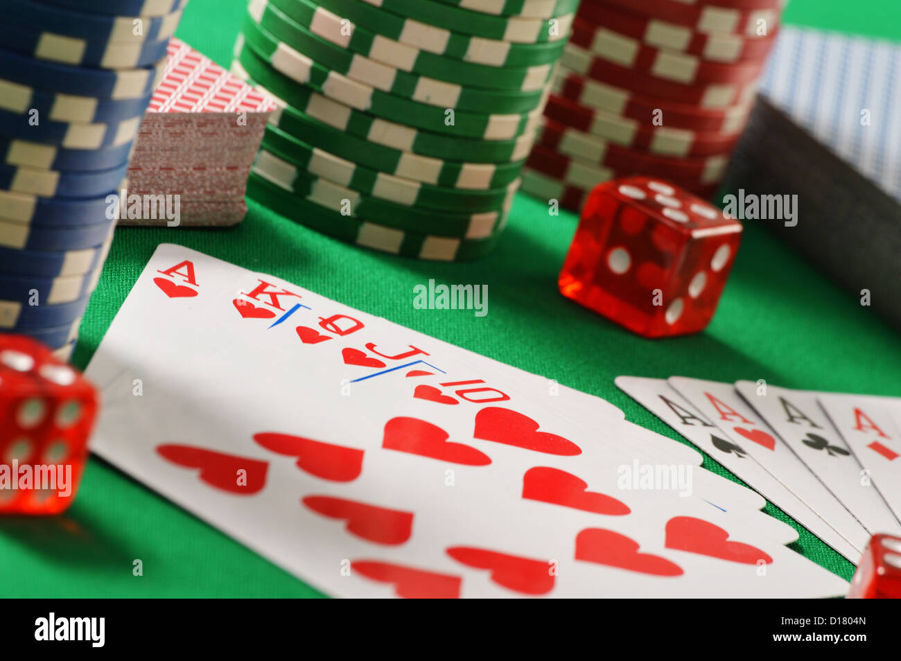 Composition with playing cards on green table Stock Photo - Alamy