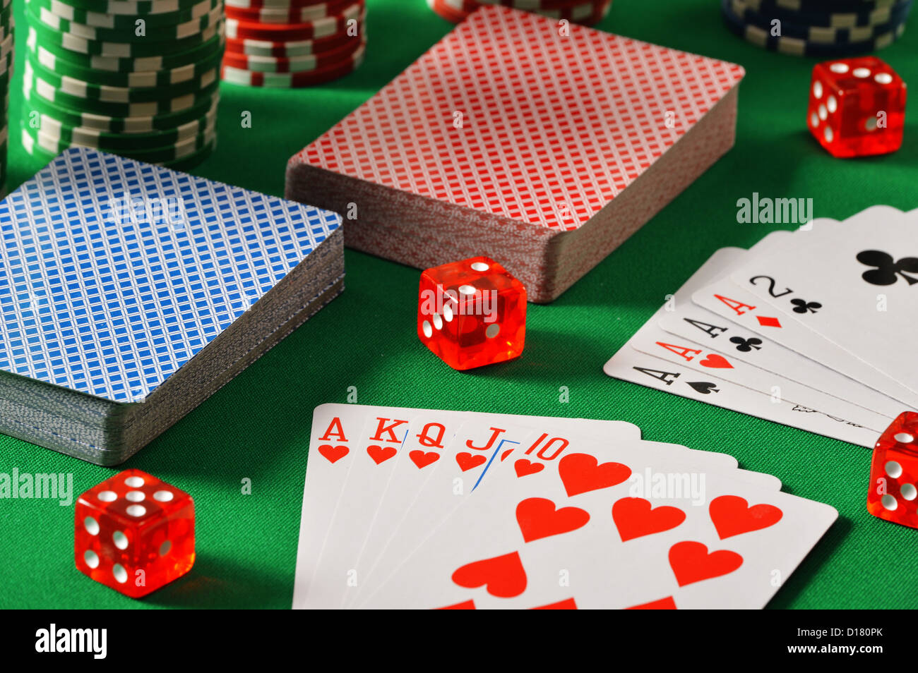 Composition with playing cards on green table Stock Photo - Alamy