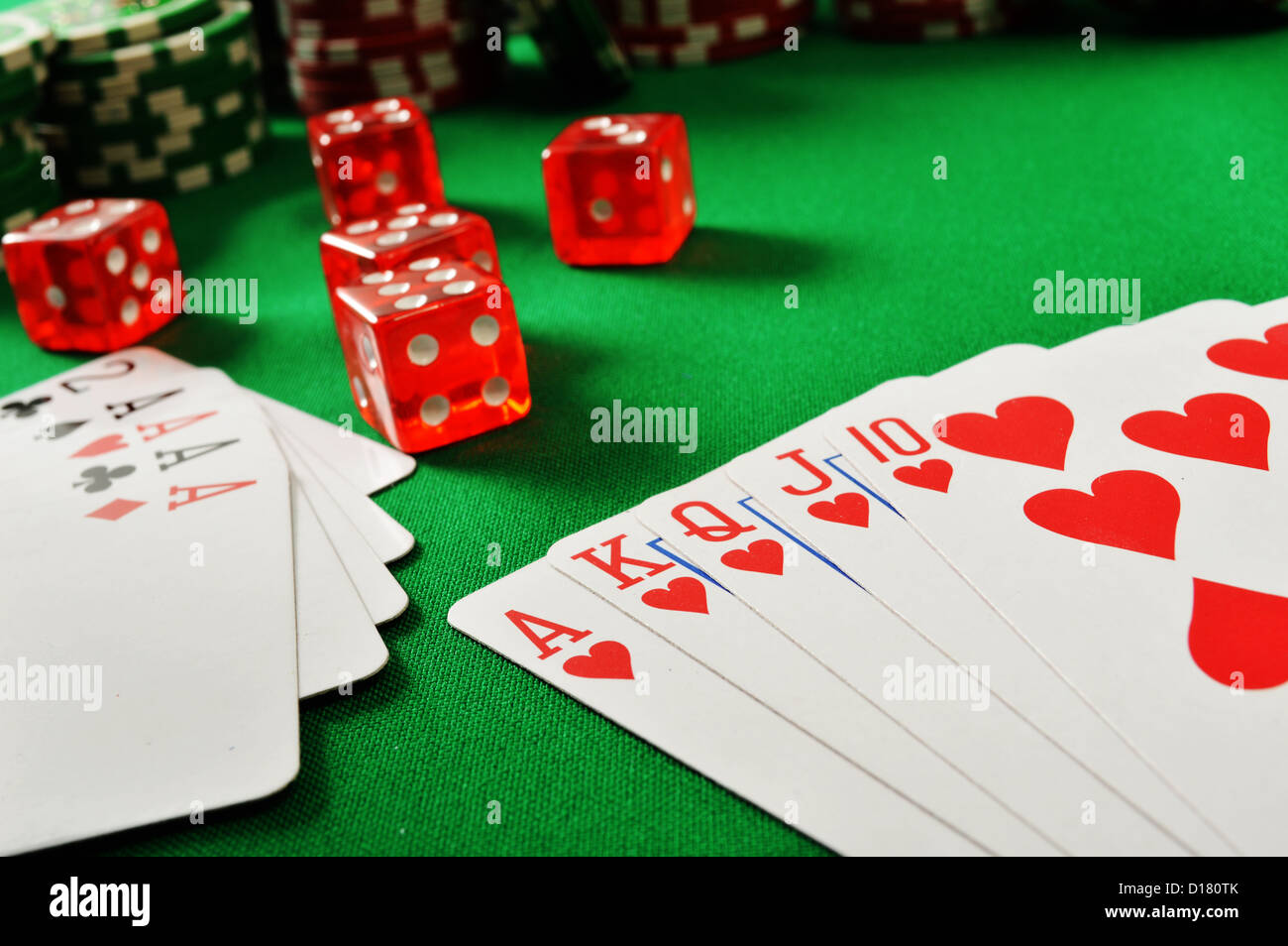 Composition with playing cards on green table Stock Photo - Alamy