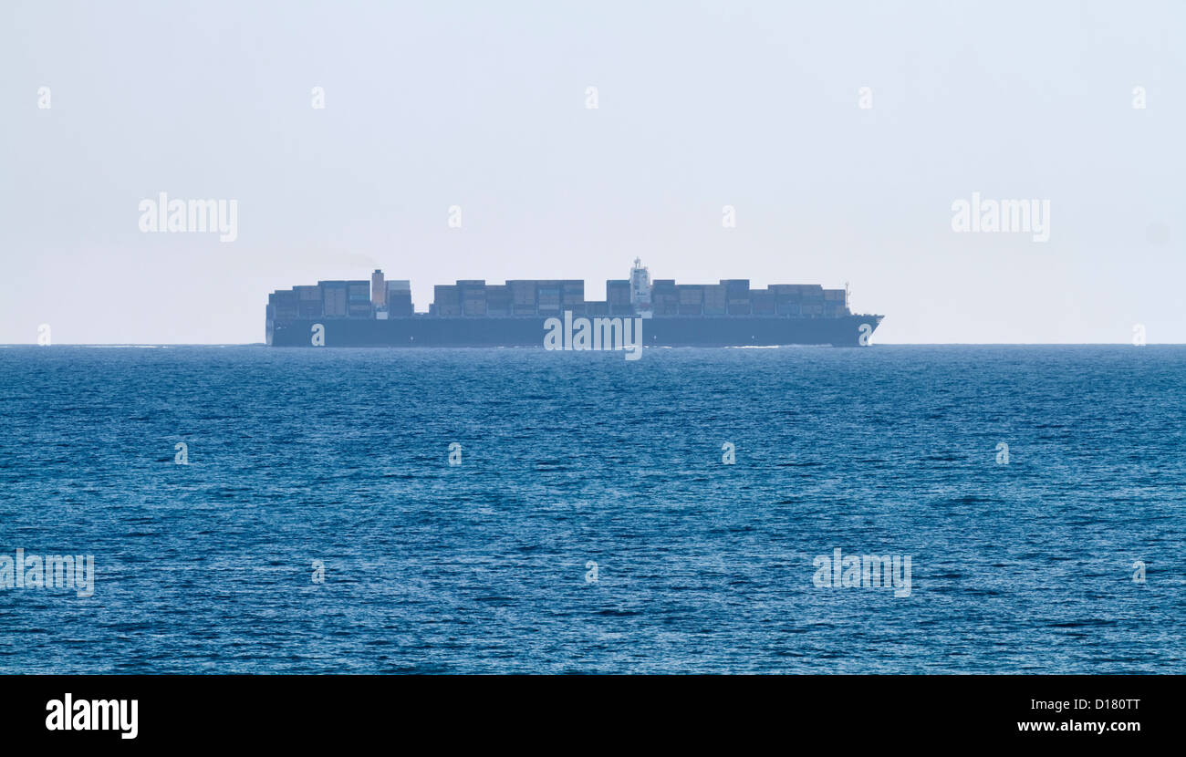 Italy, Sicily, Mediterranean sea, Cargo ship loaded with containers ...