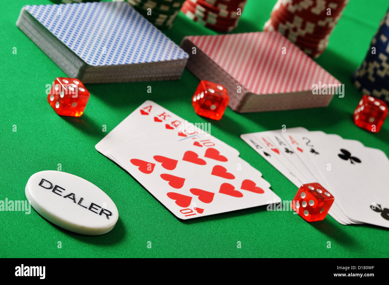 Composition with playing cards on green table Stock Photo - Alamy