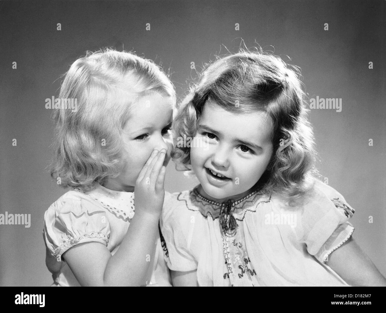 Telling secrets hi-res stock photography and images - Alamy