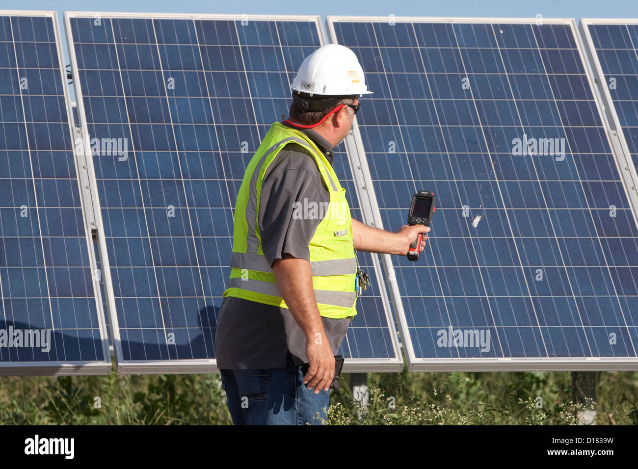 White male uses thermal imaging camera to perform quality control and ...
