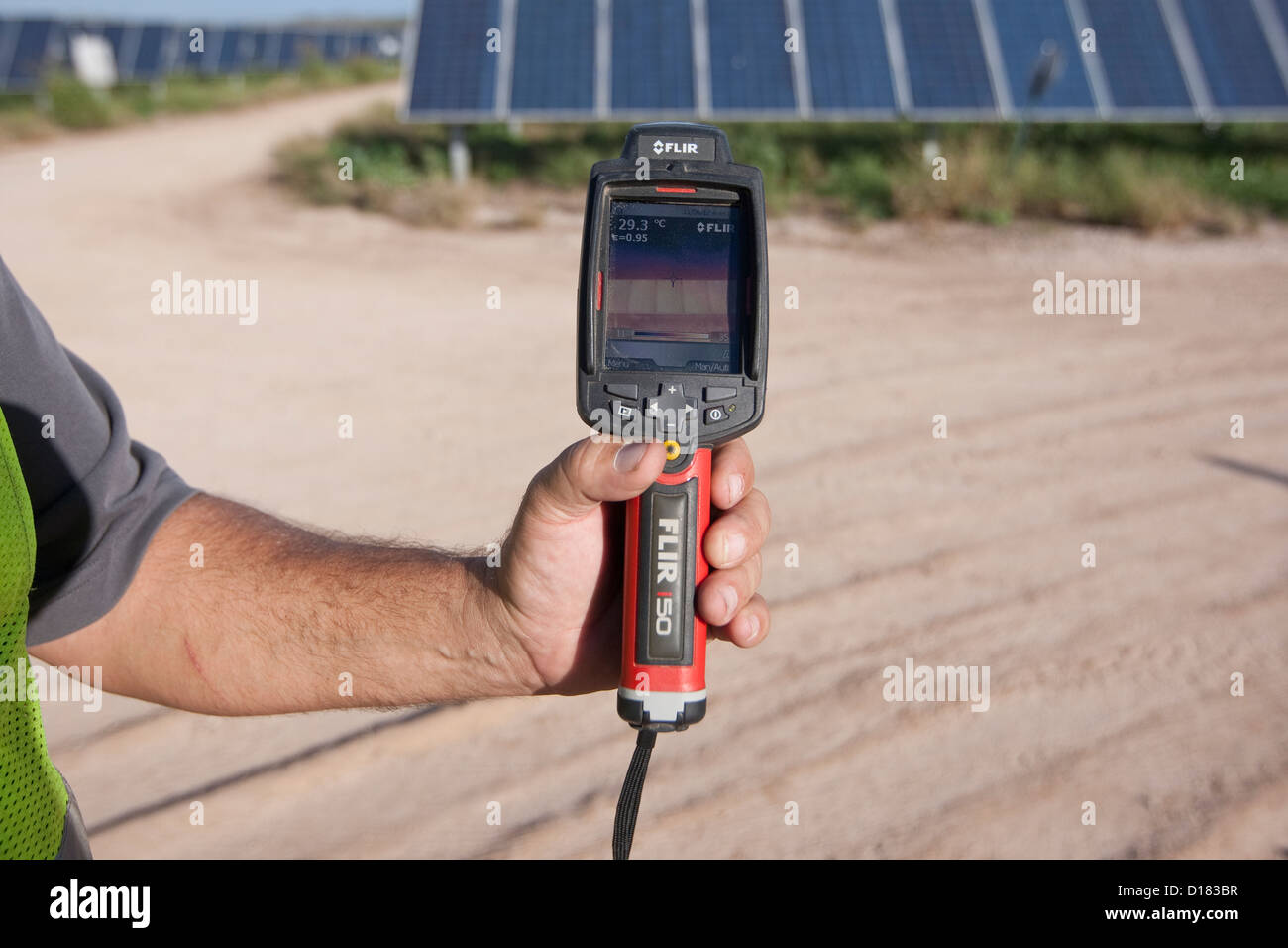 White male uses thermal imaging camera to perform quality control and ...