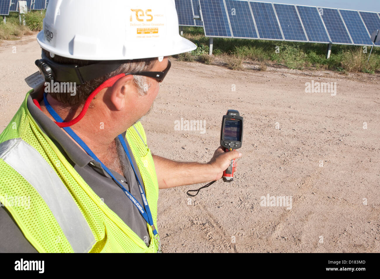 White male uses thermal imaging camera to perform quality control and ...