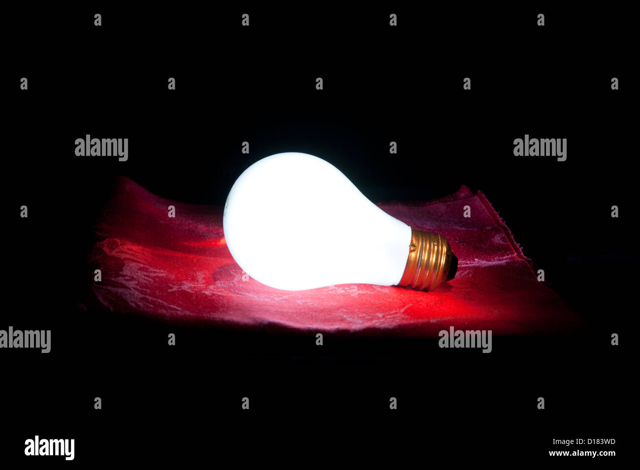 A photo of a lit light bulb without being in the socket Stock Photo - Alamy