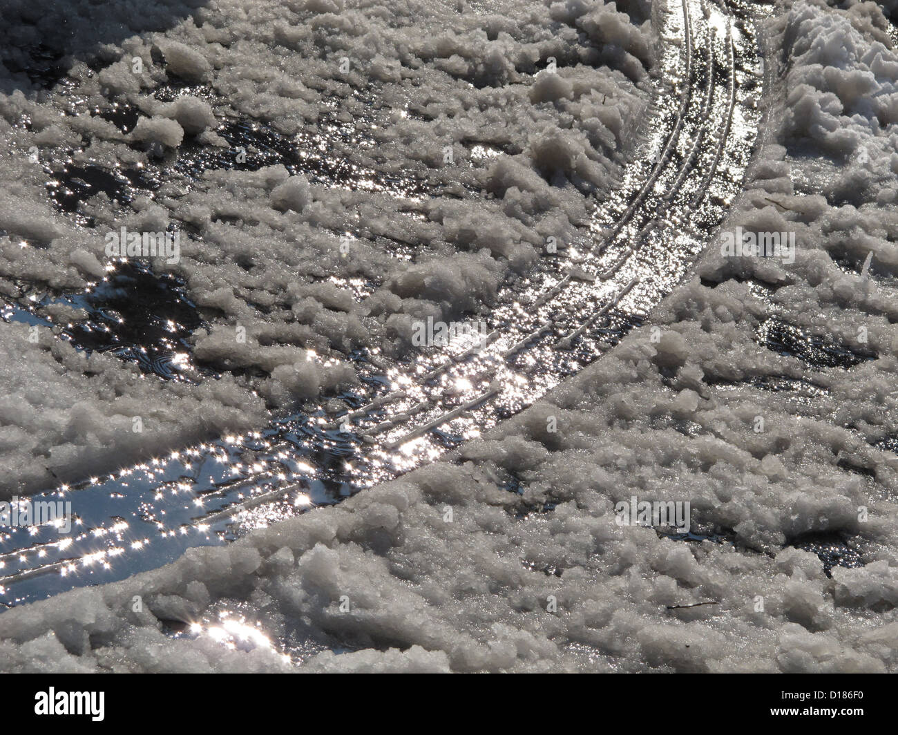 Car track marks in snow hi-res stock photography and images - Alamy