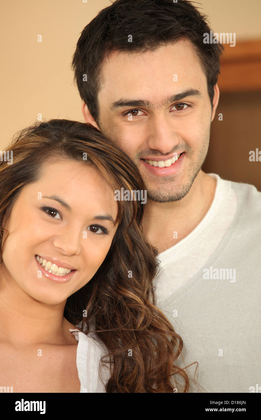 Happy couple posing Stock Photo - Alamy