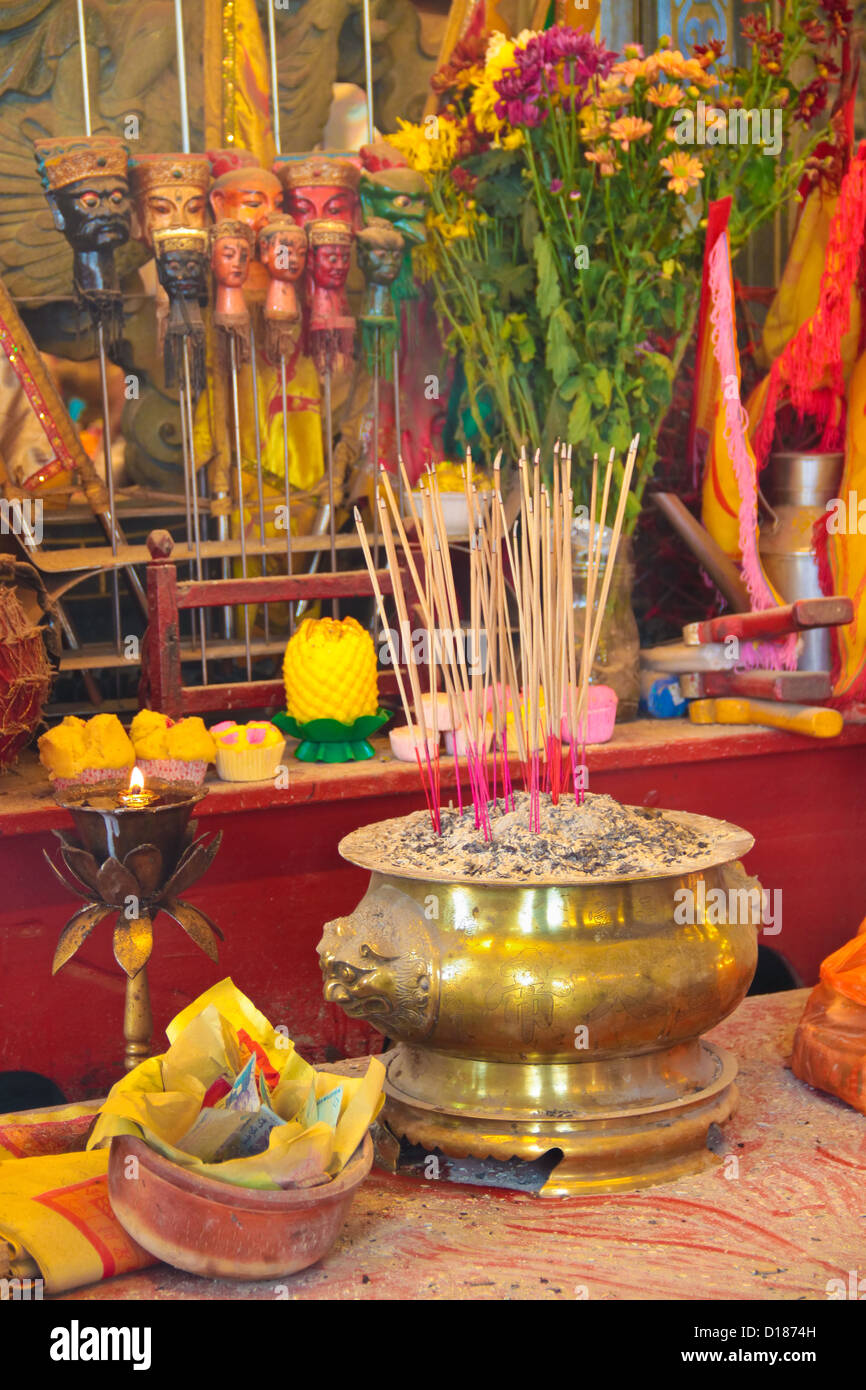 Joss stick offering to a chinese deity in a buddhish temple. Concept of ...