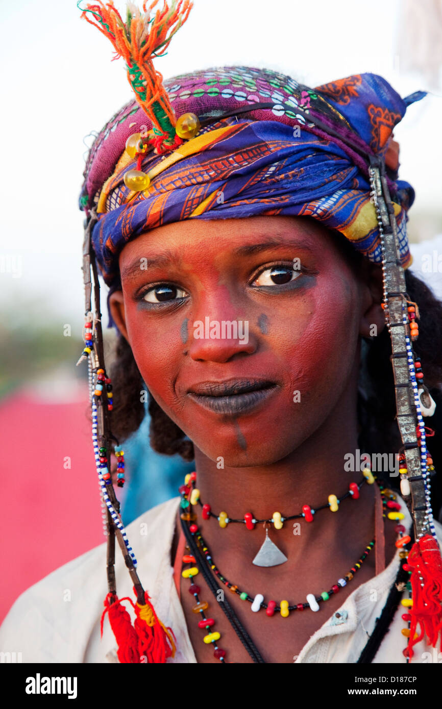 Portrait of a young Wodaabe dressed up during Gerewol festival near ...