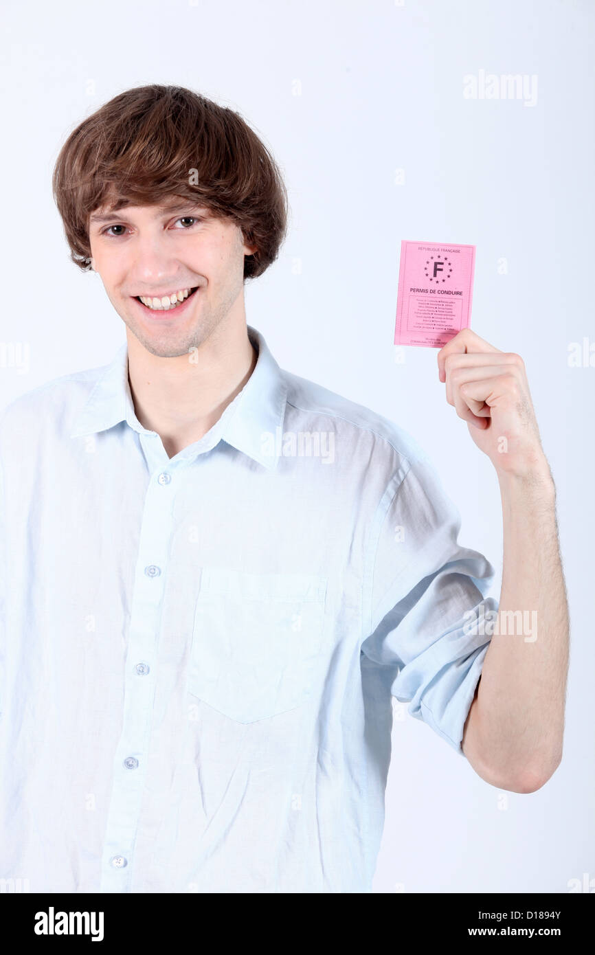 Young person showing driving licence Stock Photo - Alamy