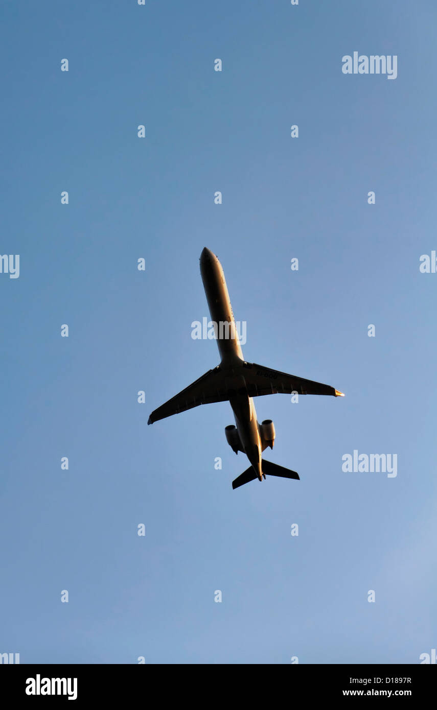 Italy, airplane flying in the sky Stock Photo - Alamy