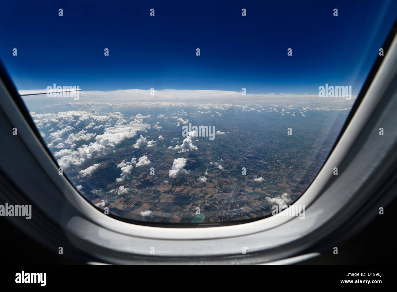 Italy, clouds seen from an airplane window Stock Photo - Alamy