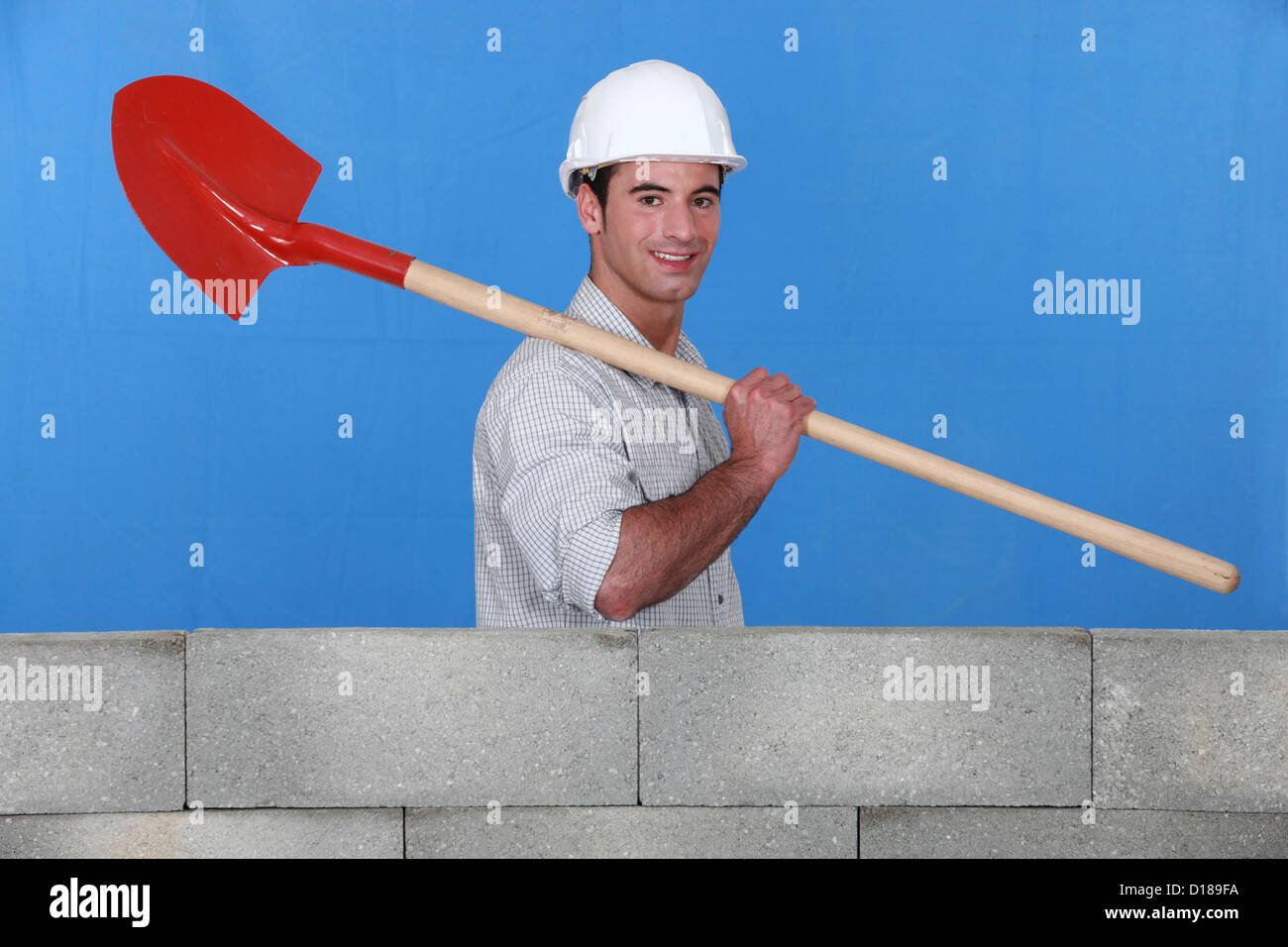 Construction worker carrying bricks hi-res stock photography and images ...