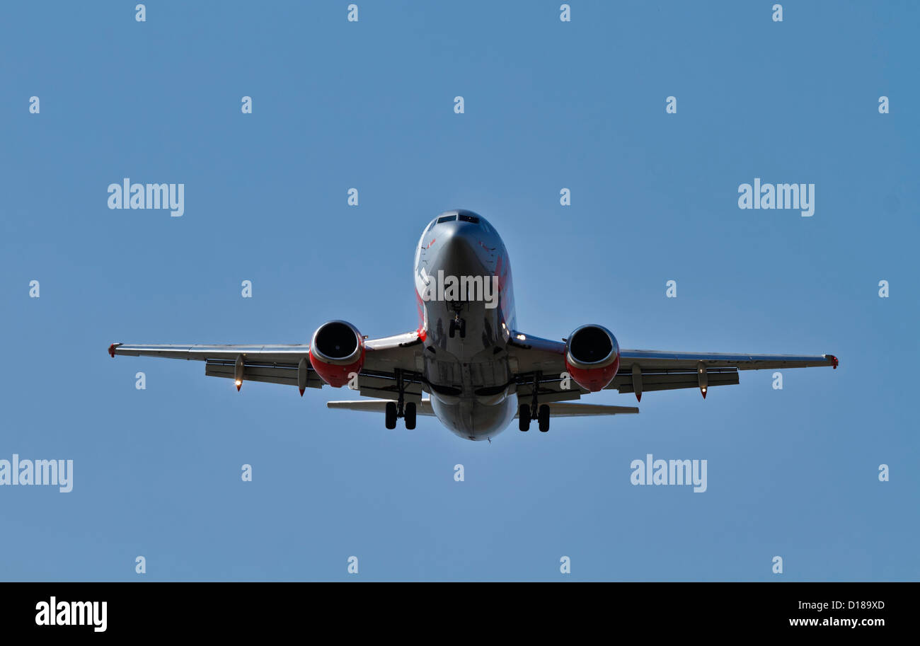 Italy, airplane flying in the sky Stock Photo - Alamy