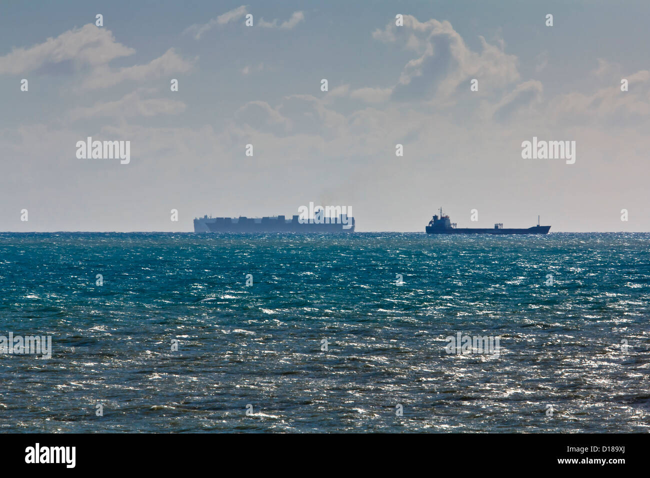 Italy, Sicily, Mediterranean sea, cargo ships and an oil thank in the ...