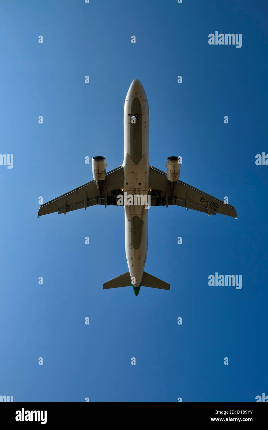 Italy, airplane flying in the sky Stock Photo - Alamy