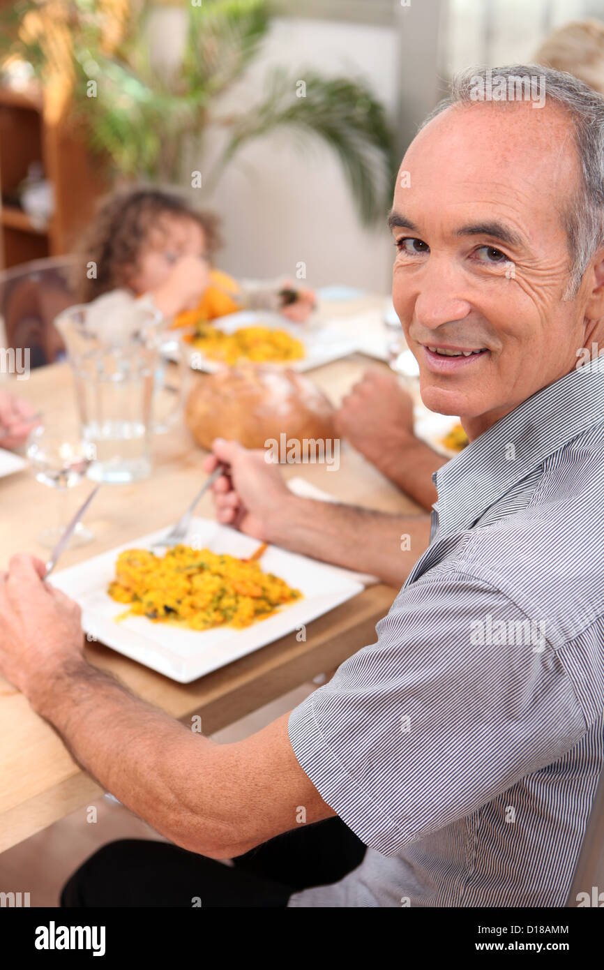 Family eating paella Stock Photo - Alamy