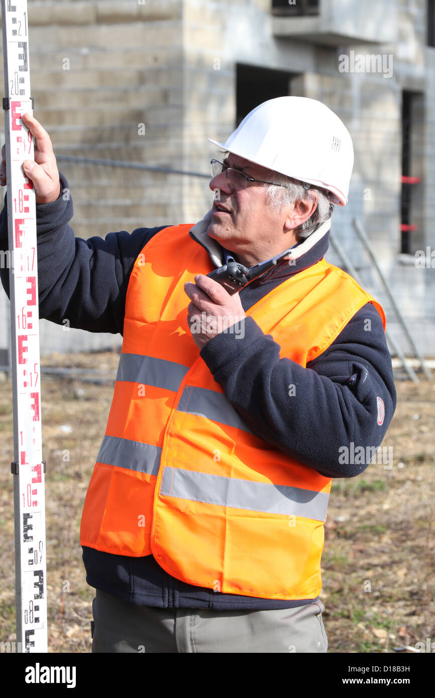 Experienced construction site surveyor Stock Photo - Alamy