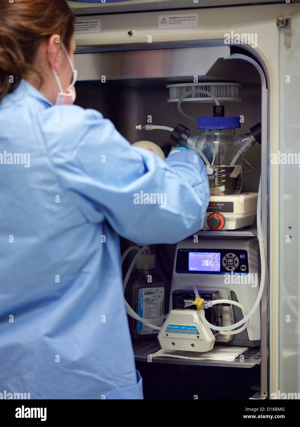 A lab technician conducting various experiments in a research lab Stock ...