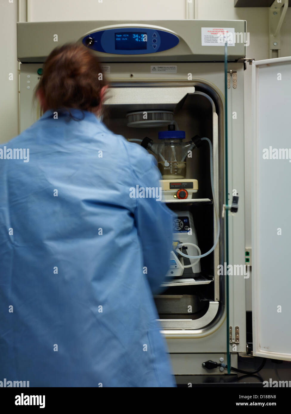 A lab technician conducting various experiments in a research lab Stock ...