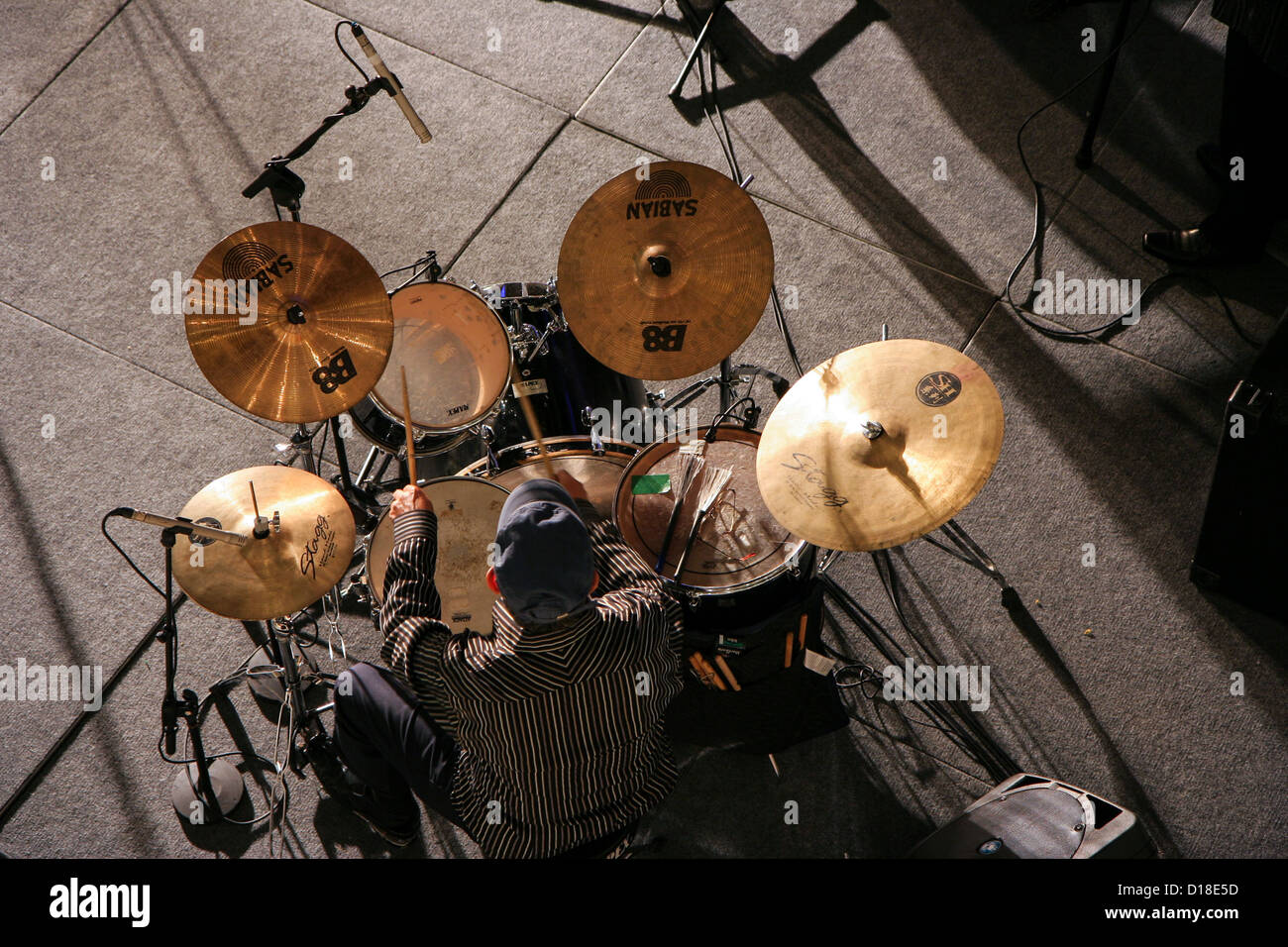 Man playing drum in a music band performance Stock Photo - Alamy