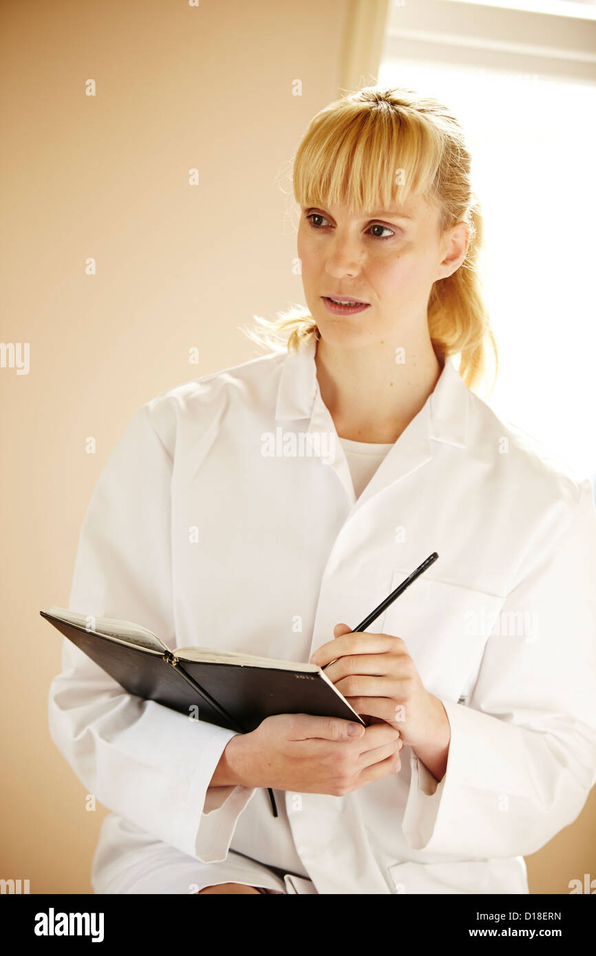 Female taking notes Stock Photo - Alamy